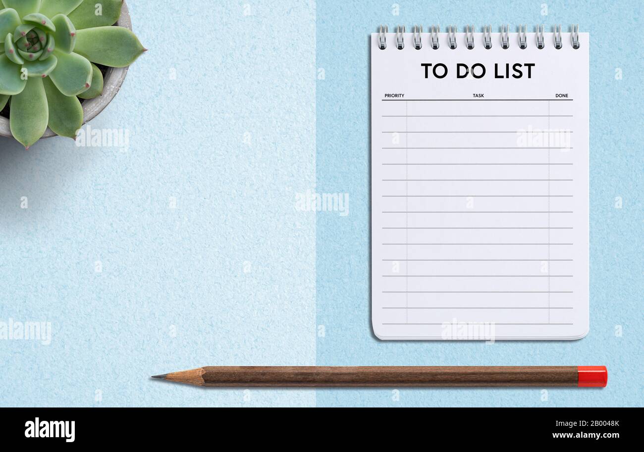 to do list notepad on blue paper background Stock Photo - Alamy