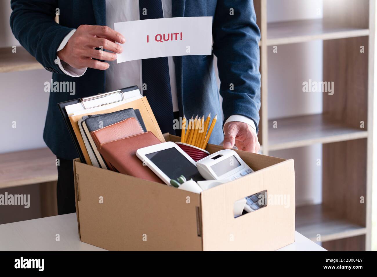 Businessman holding with I quit words card letter, resign employee ...