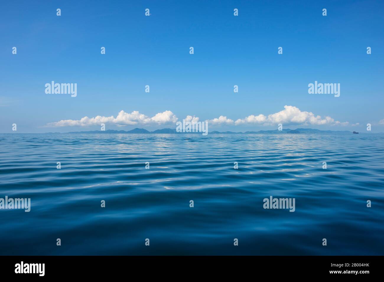 Blue Ocean with waves and clear blue sky Blue water surface. Travel ...