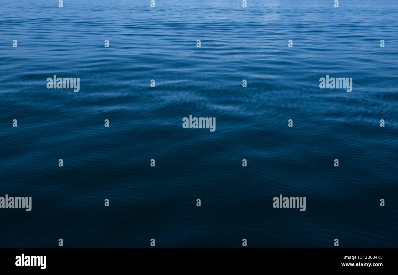Blue water background with ripples Sea low angle view, Ocean, Wave ...