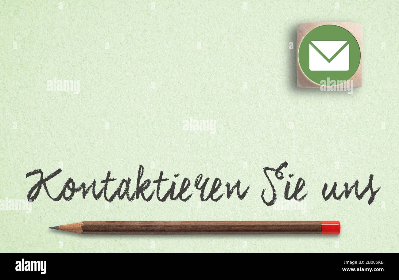 German message for "contact us" and a pen on paper background Stock ...