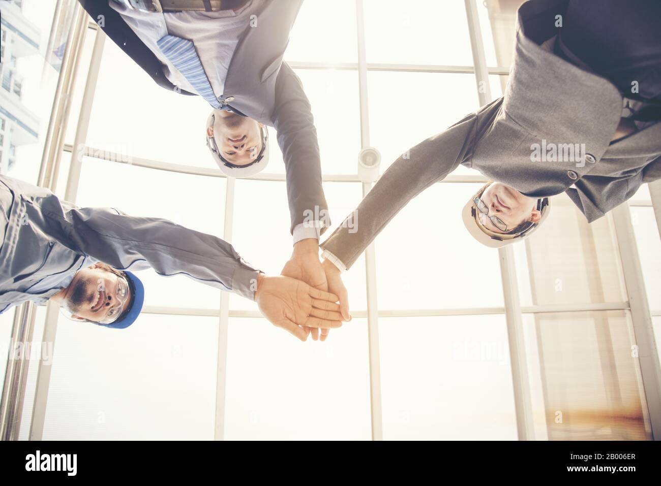 Business team two men woman hi-res stock photography and images - Alamy