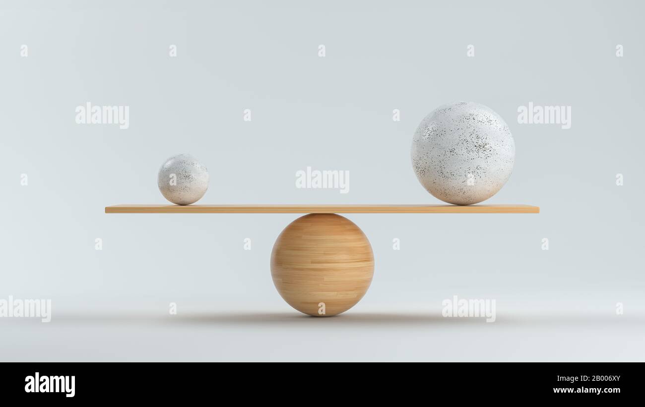 wooden scale balancing one big ball and one small ball in front white ...