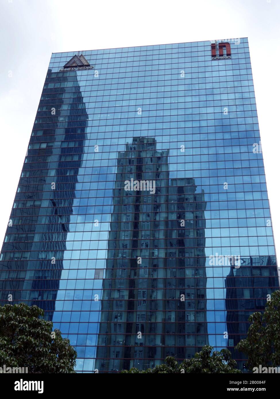 The reflections of high rise buildings in another glass paneled high ...