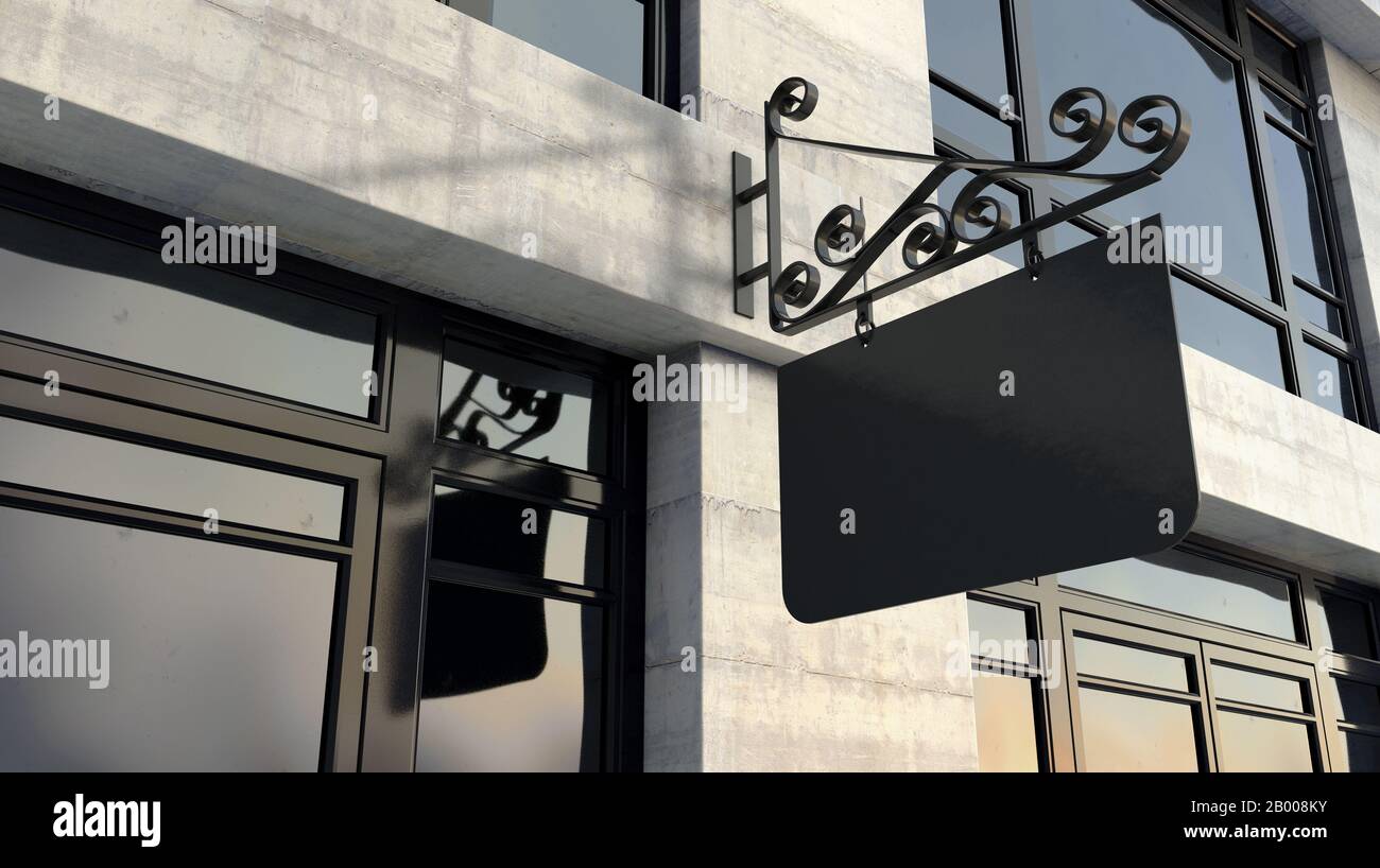 An ornate sign mounted outside a generic unbranded shop facade on the ...