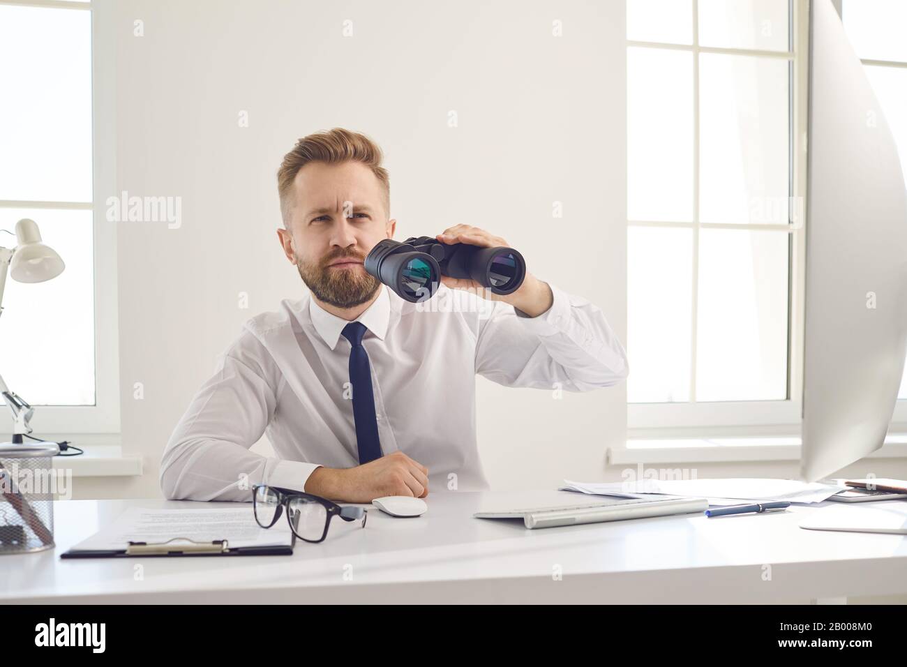 Sitting man binocular hi-res stock photography and images - Alamy