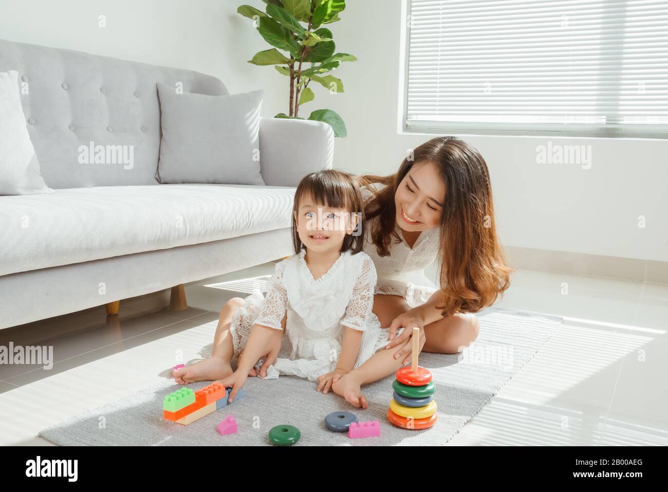 Mother daughter playing in playground hi-res stock photography and images - Alamy