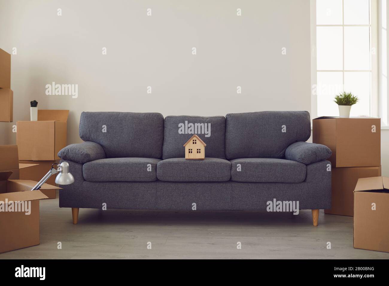 Model of the house on the floor in the new bright sunny house Stock ...