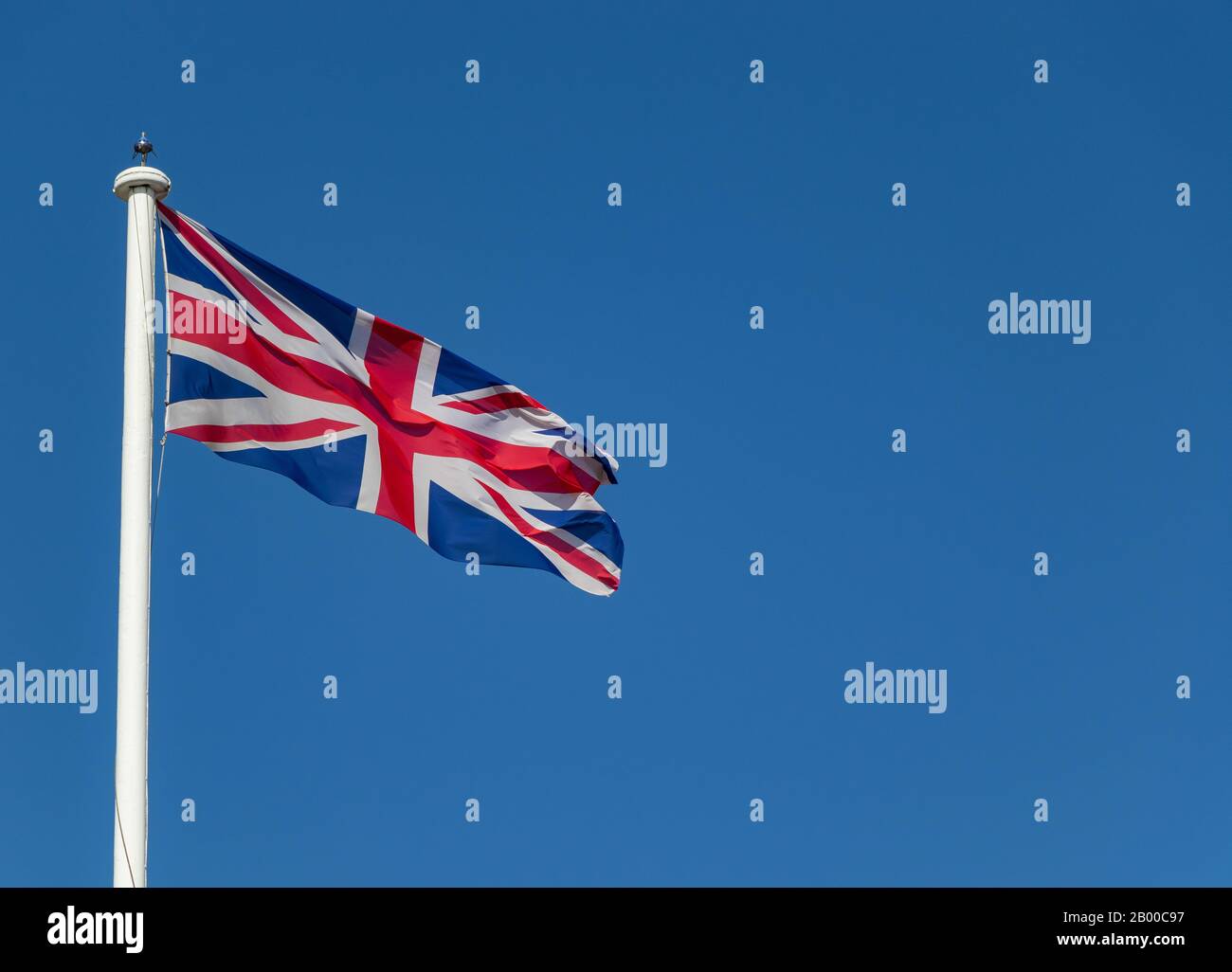 Top of tower of houses of parliament with british flag hi-res stock ...