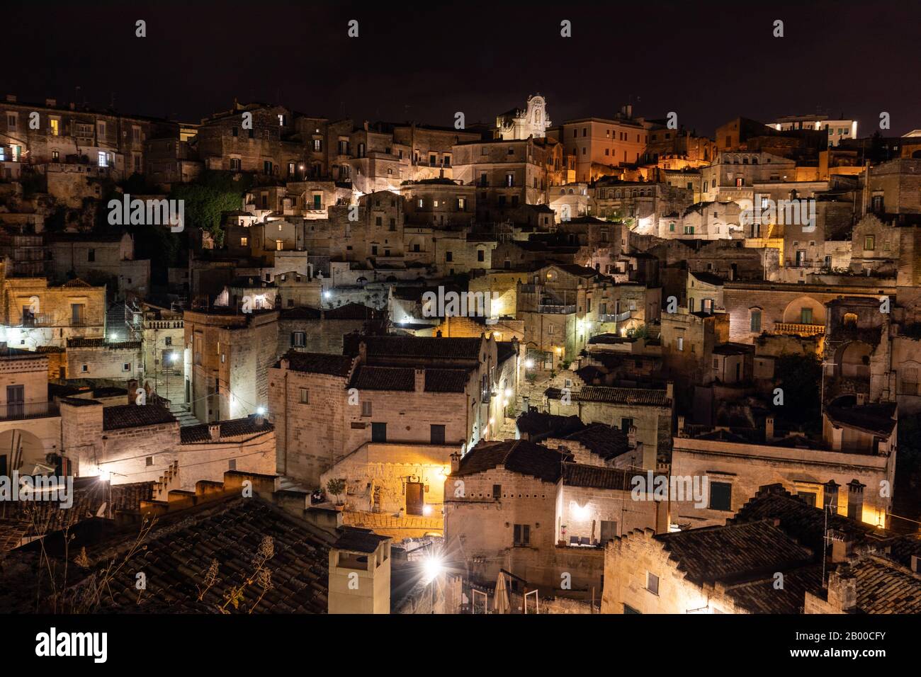 Amazing lighted buildings in ancient Sassi district by night in Matera ...