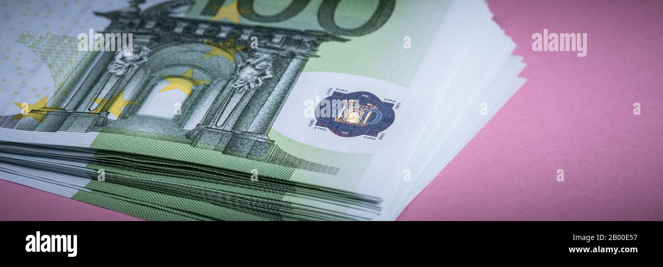Euro cash on a lilac, purple and pink background. Euro Money Banknotes ...