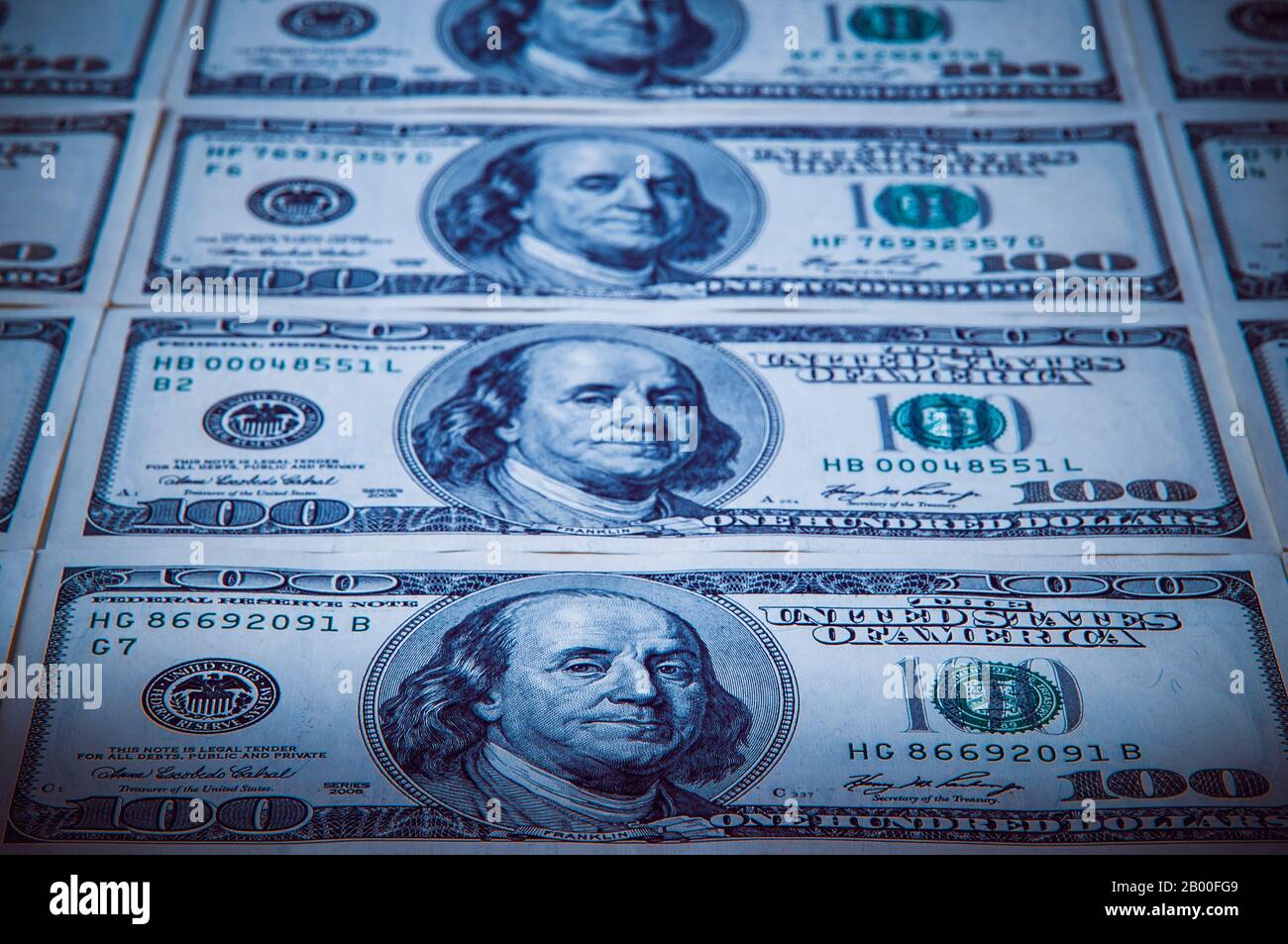 The background of a one hundred dollar bill. Style blue light Stock ...