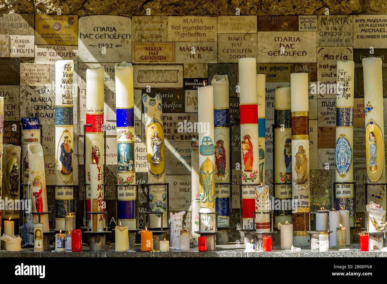 Sacrificial candles, votive candles, grotto of Mary in the forest ...