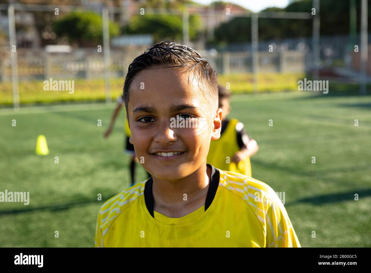 Front view soccer player looking at the camera Stock Photo - Alamy
