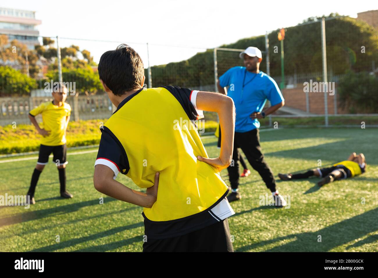 Soccer players stretching after training Stock Photo - Alamy