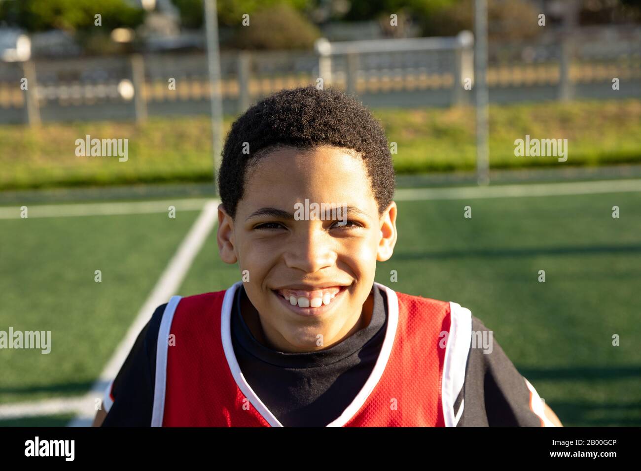 Front view soccer player looking at the camera Stock Photo - Alamy