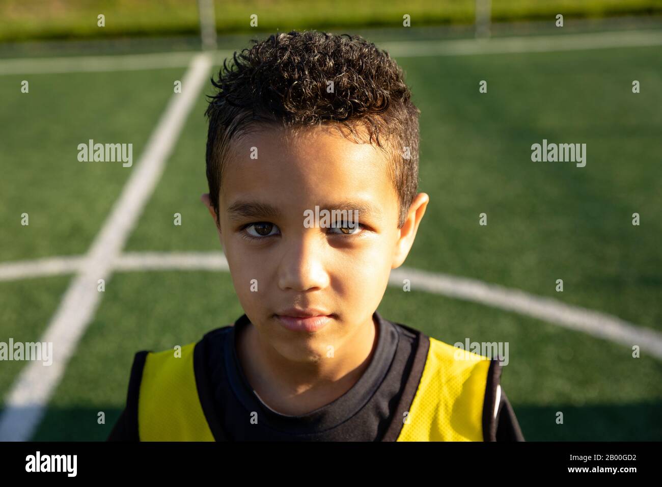 Front view soccer player looking at the camera Stock Photo - Alamy