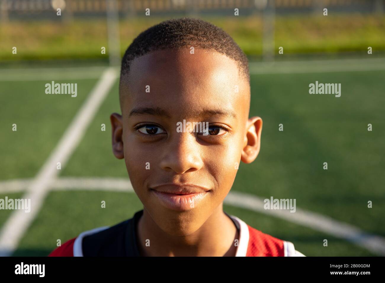 Front view soccer player looking at the camera Stock Photo - Alamy