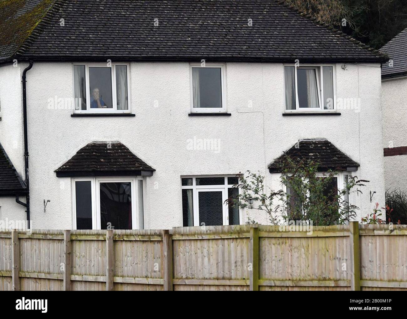 A man looks at flooding outside his house from his window in Monmouth ...