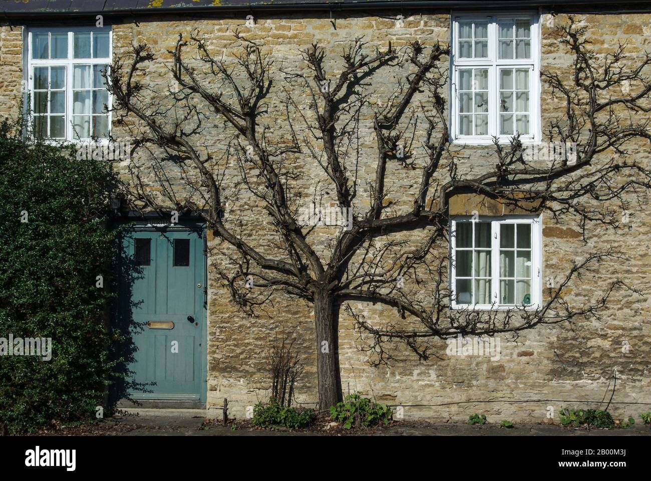 Winter view of a stone built cottage in the village of Aynho ...