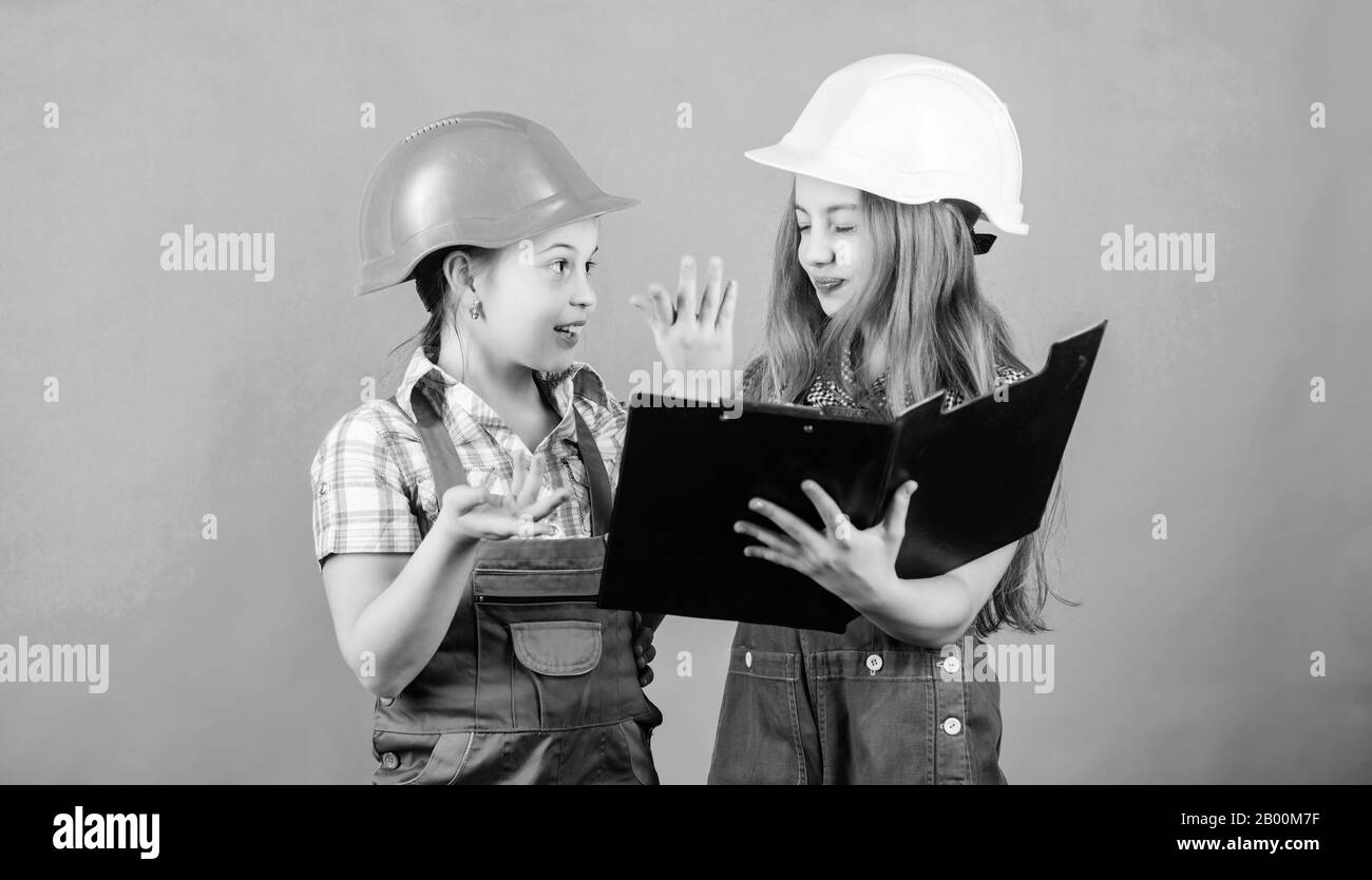 small girls repairing together in workshop. Labor day. 1 may. school ...