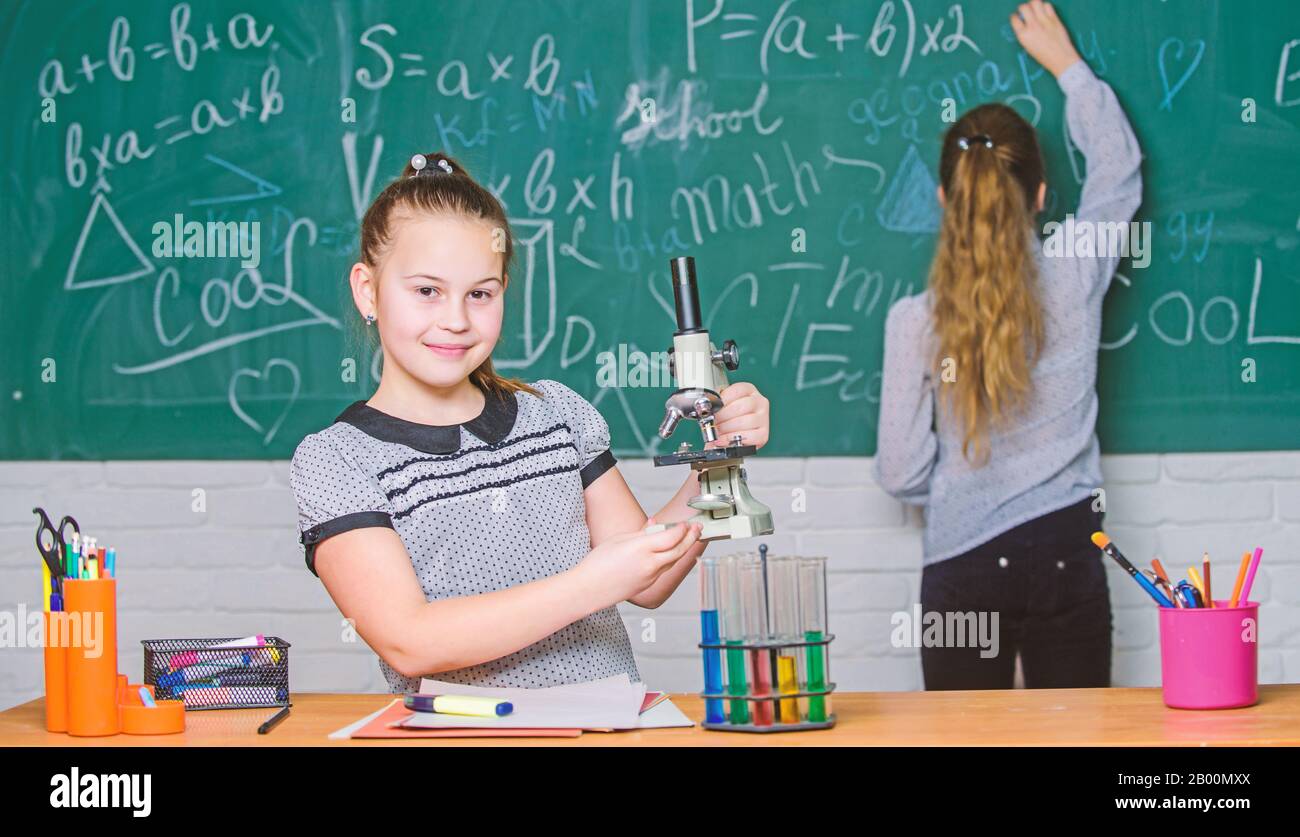 I can cure you. Little girls in school lab. Formal school education ...