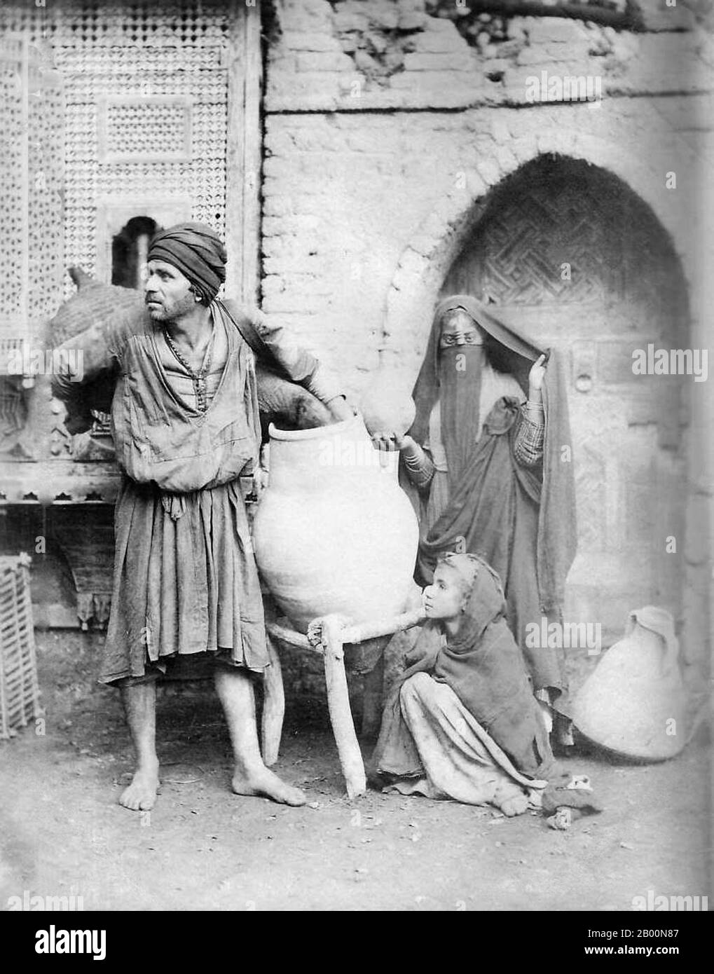 Algeria: Portrait of a water carrier and his family, Kasbah, Algiers ...