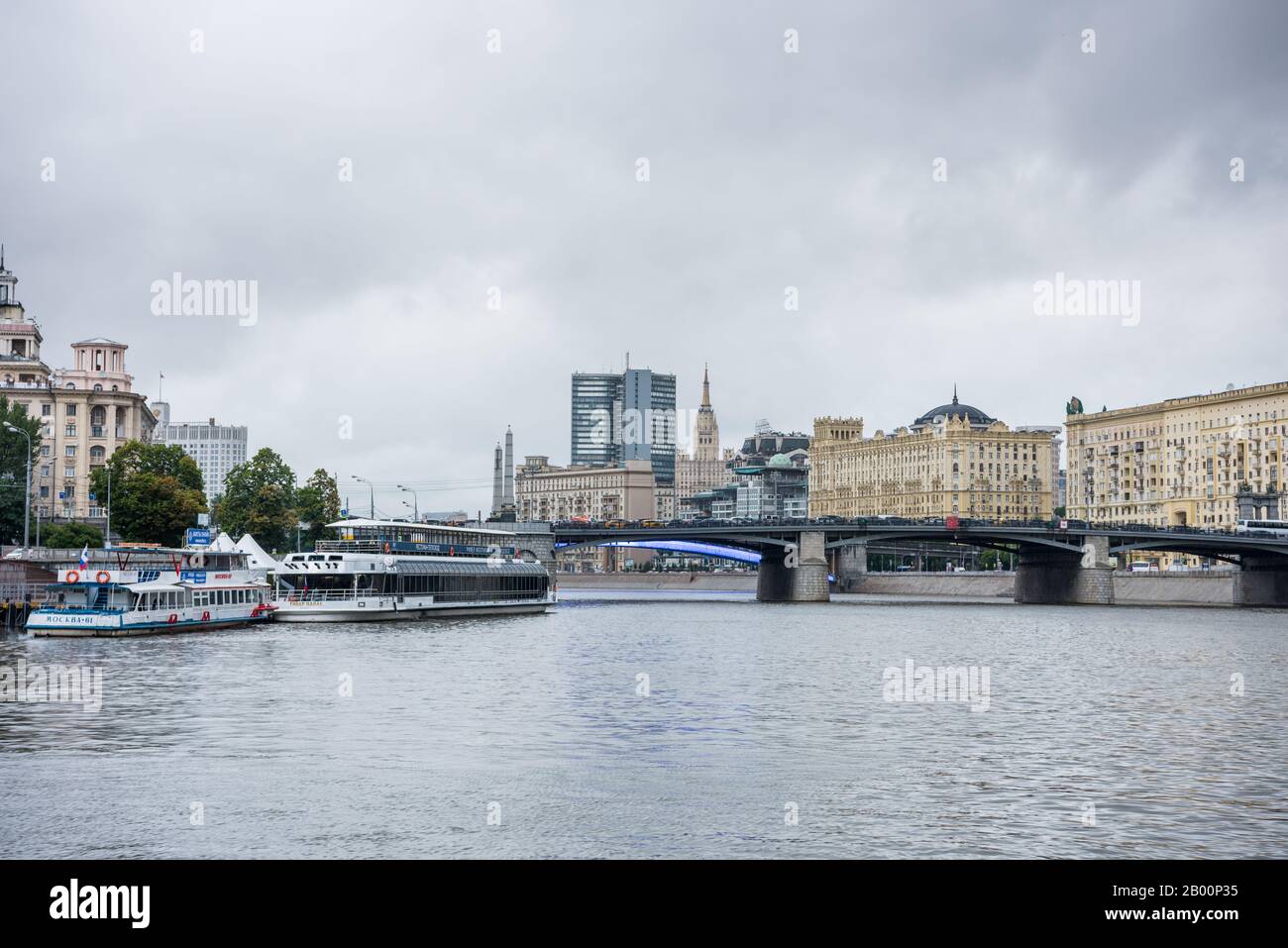 Historic buildings and at the riverbank and a bridge accross the Moskva ...