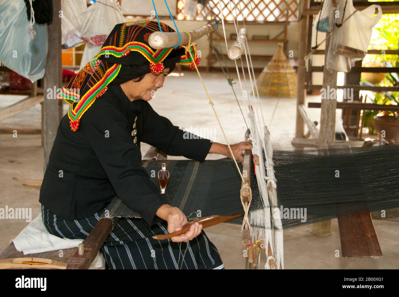Thailand: A weaver of the 12th District Tai Dam Weaving Group, Ban Na ...