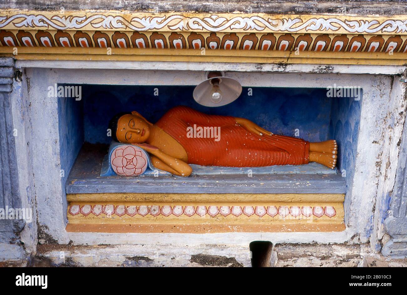 Sri Lanka: Reclining Buddha, Isurumuniya Vihara, Anuradhapura. Isurumuniya Vihara is a rock ...