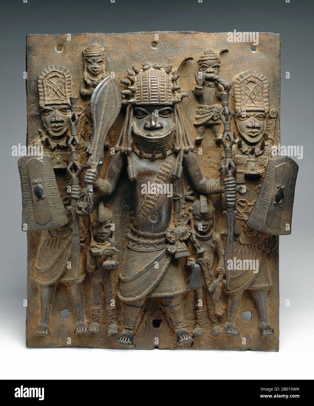 Nigeria: Warrior with two attendants, followers in background. Bronze ...