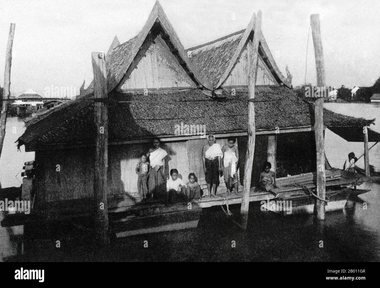 Thailand: A Siamese family poses for a photograph on their floating ...
