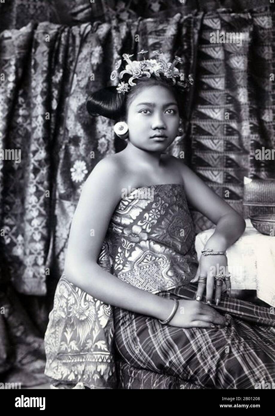 Indonesia: Female Balinese dancer, seated in elaborate costume, c. 1910 ...