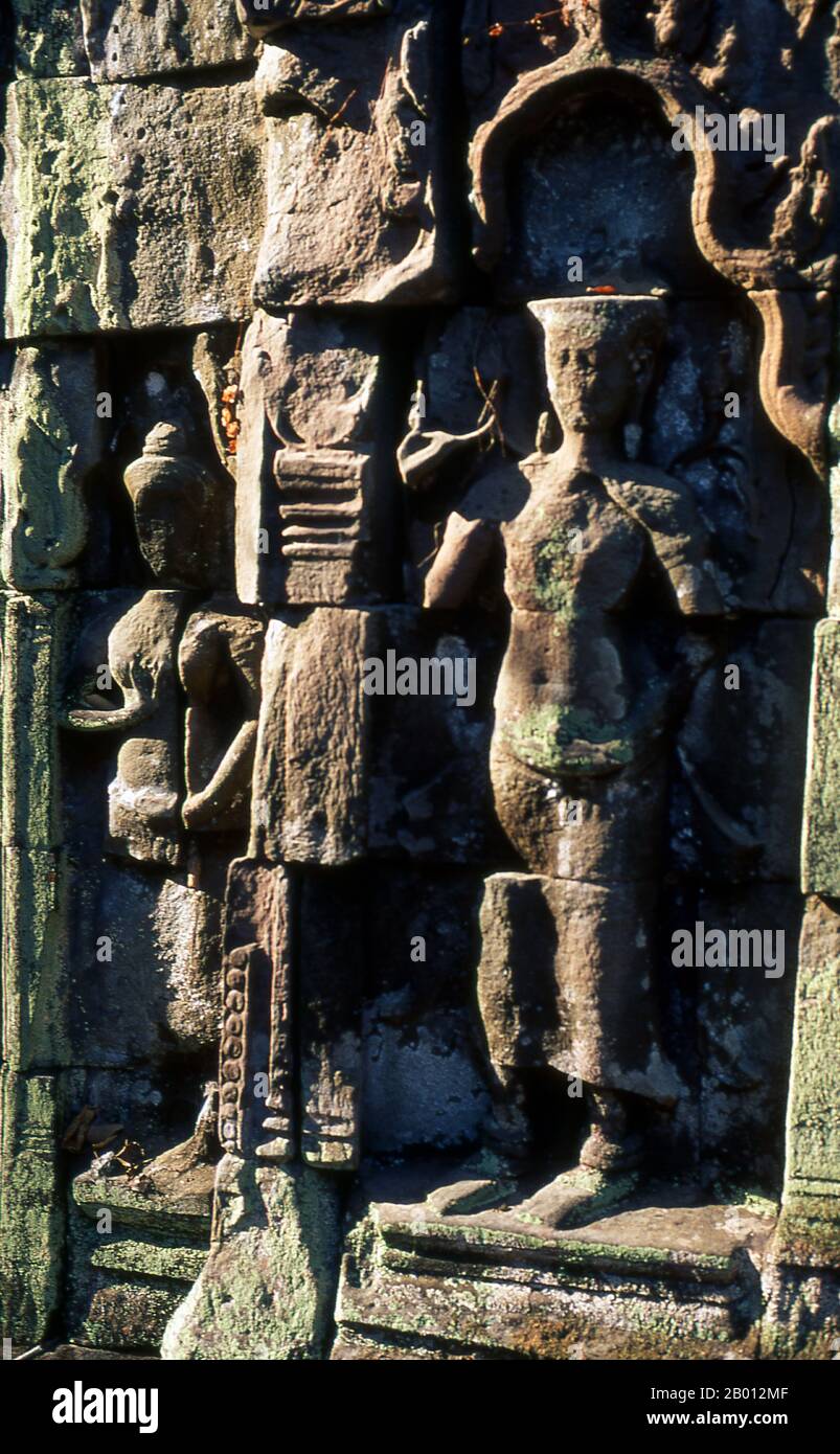 Cambodia: Statues adorning a wall, Ta Prohm, Angkor. Ta Prohm was built ...