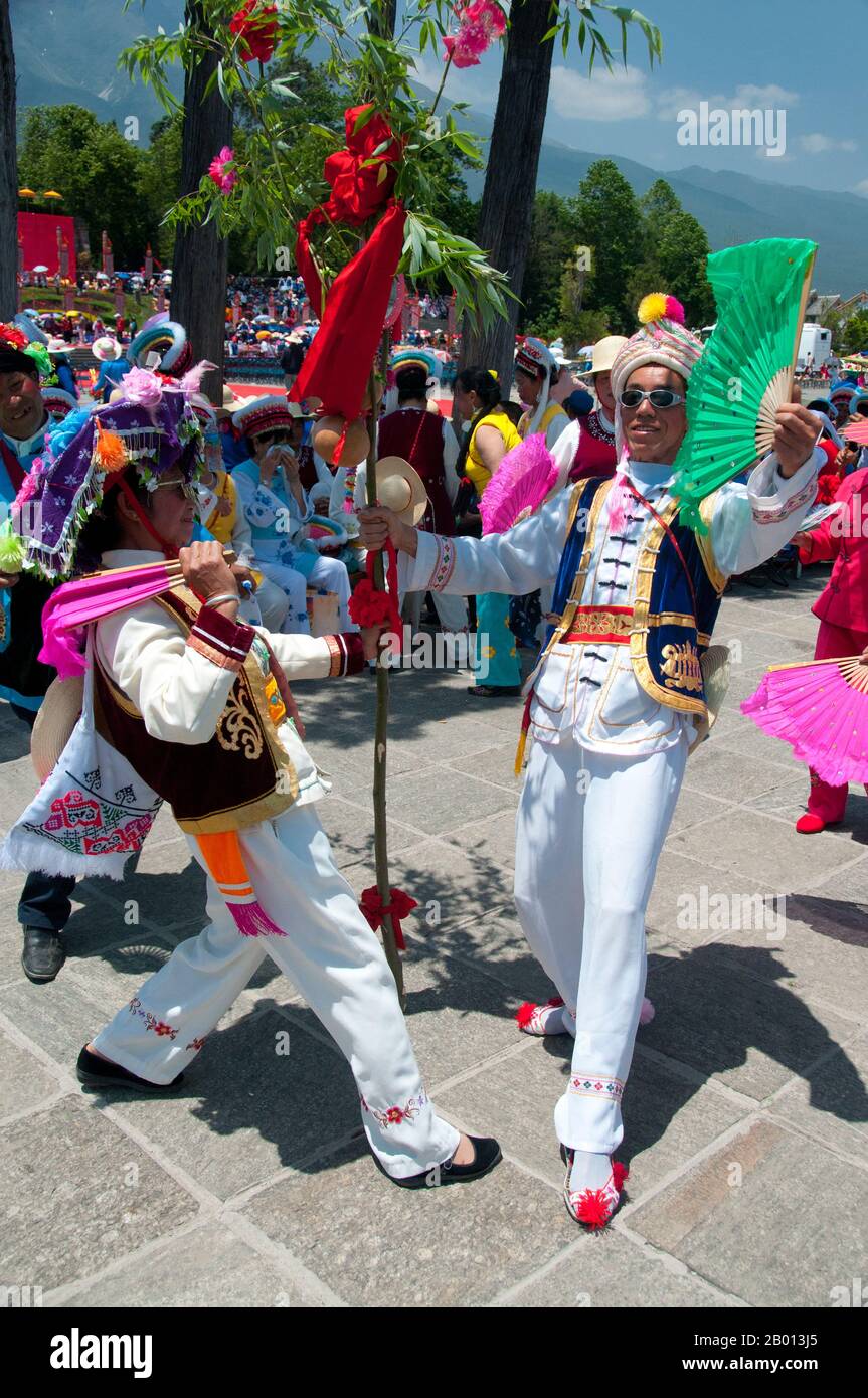China: A Bai couple dance at the Bai music and dance festival at Santa ...