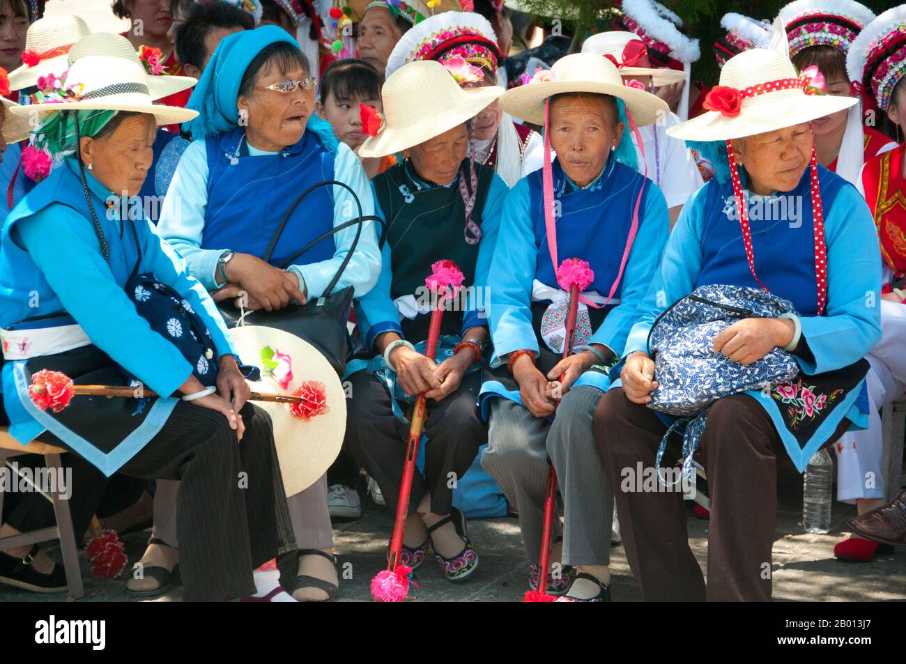 China: Elderly Bai woman at the Bai music and dance festival at Santa ...