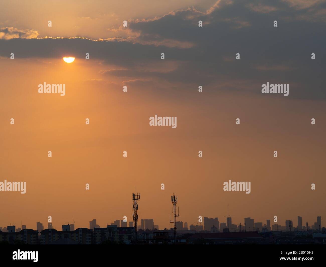 Sunrise over buildings in city. Skyline view of cityscape with sunlight ...