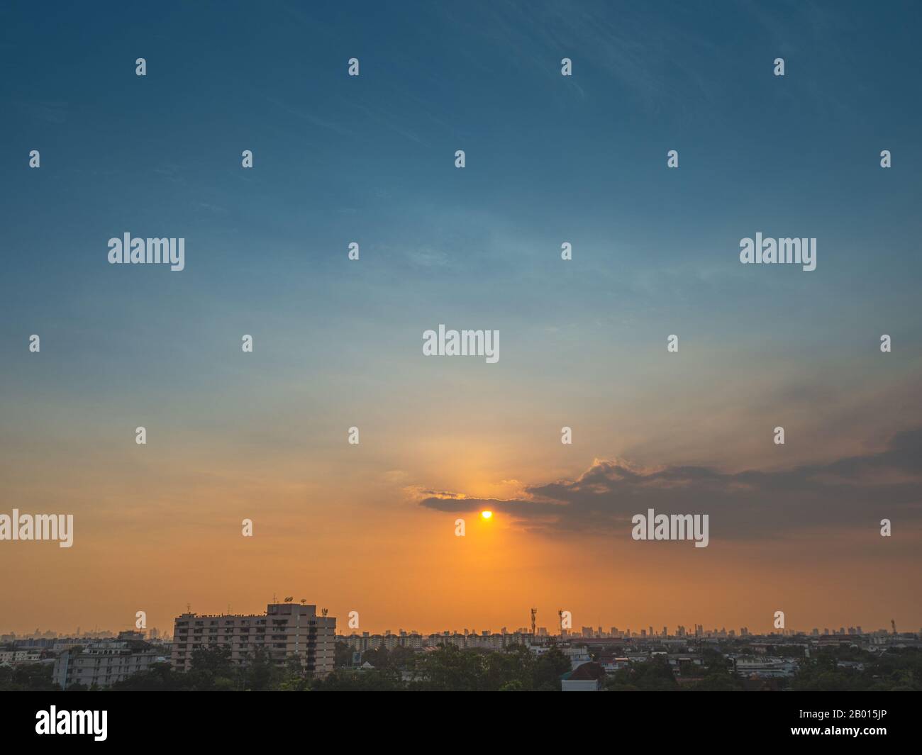 Sunrise over buildings in city. Skyline view of cityscape with sunlight ...