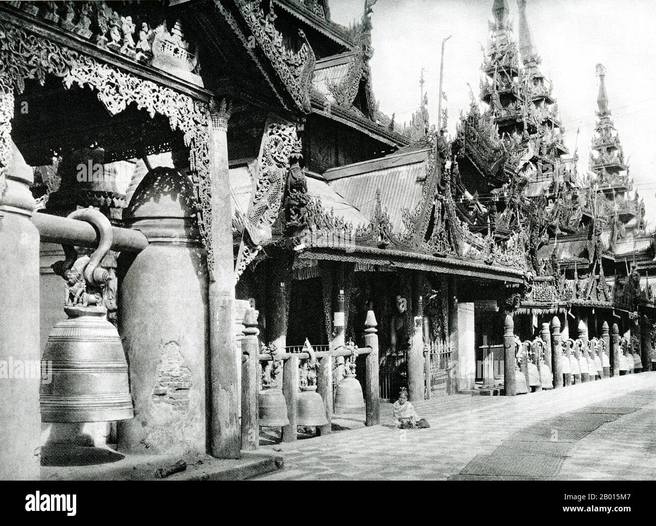 Burma/Myanmar: A brass bell and chedis inside the compound of ...