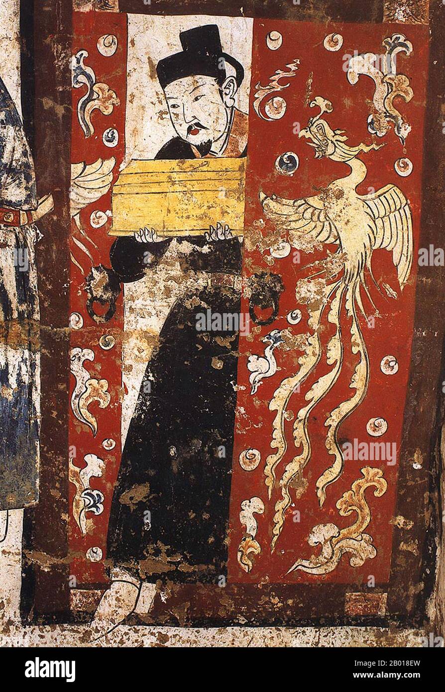 China: Man carrying a box with sutras through a phoenix-painted door in ...