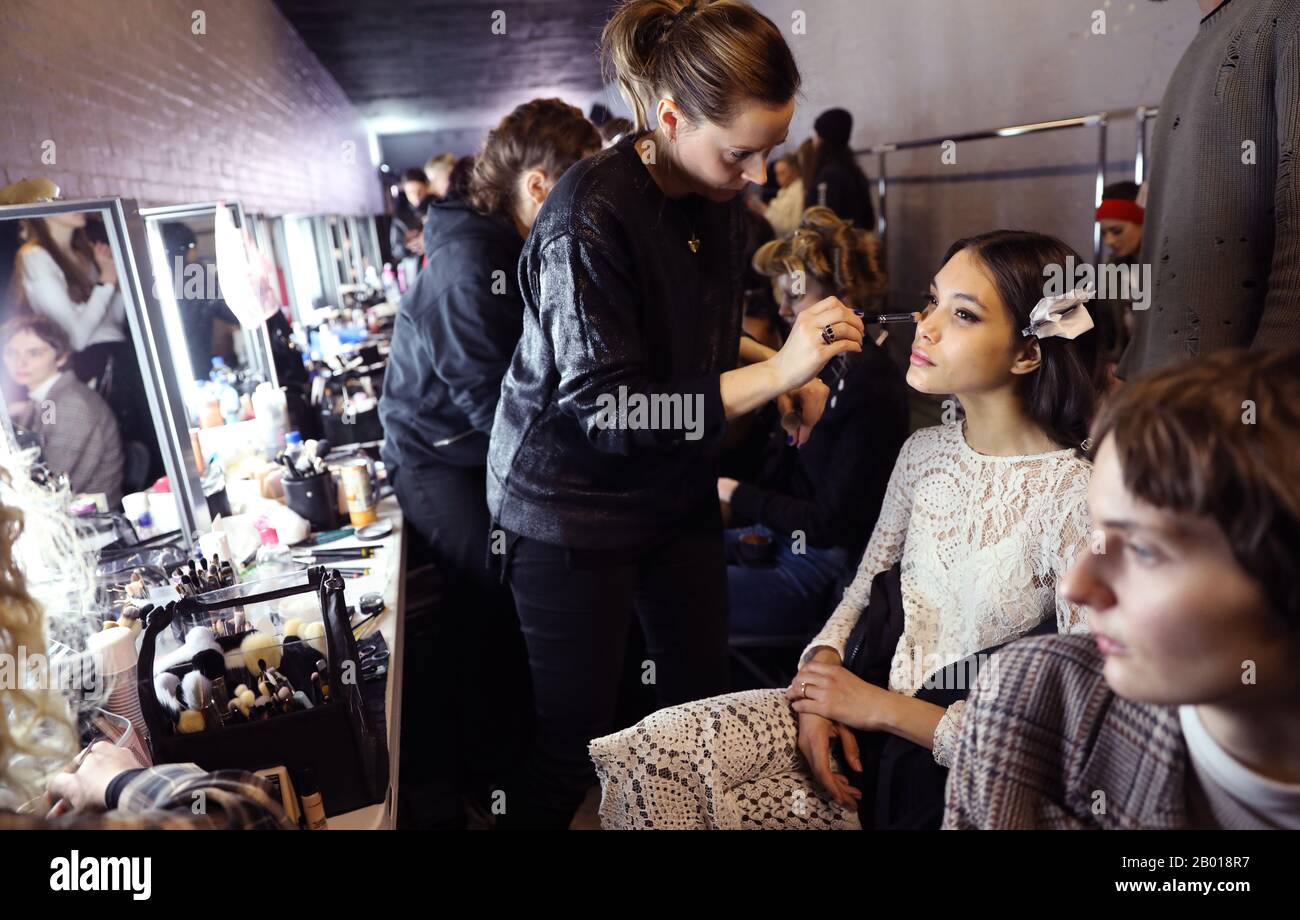 A model being prepared backstage for the Mark Fast show at London ...