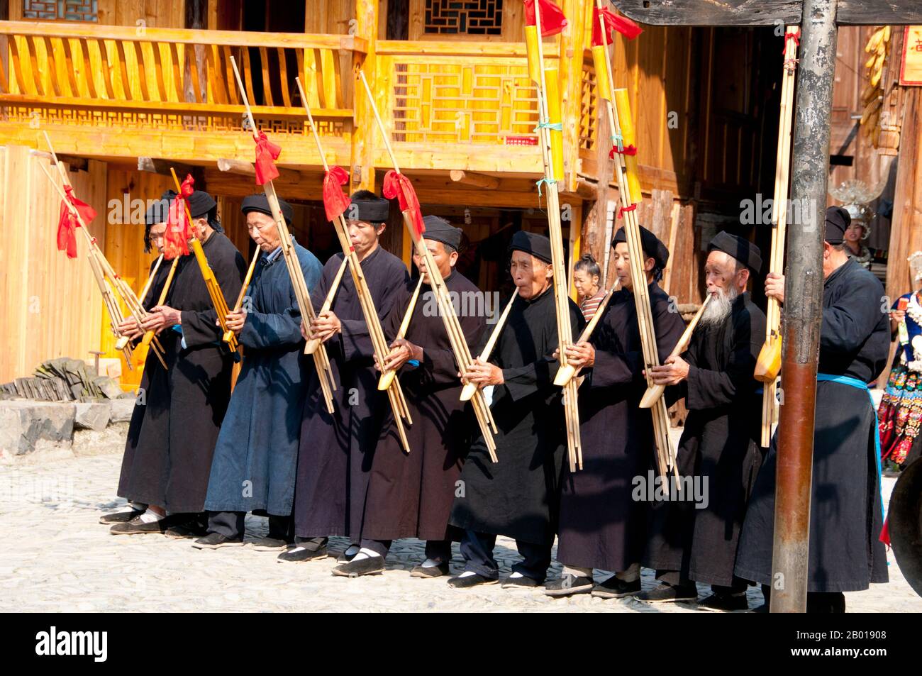 China: Miao men playing the lusheng, a traditonal Miao instrument, in ...