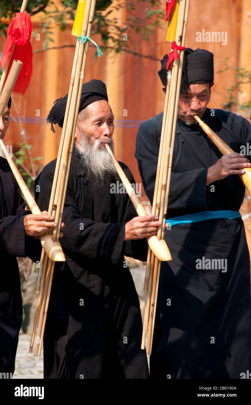 China: Miao men playing the lusheng, a traditonal Miao instrument, in ...