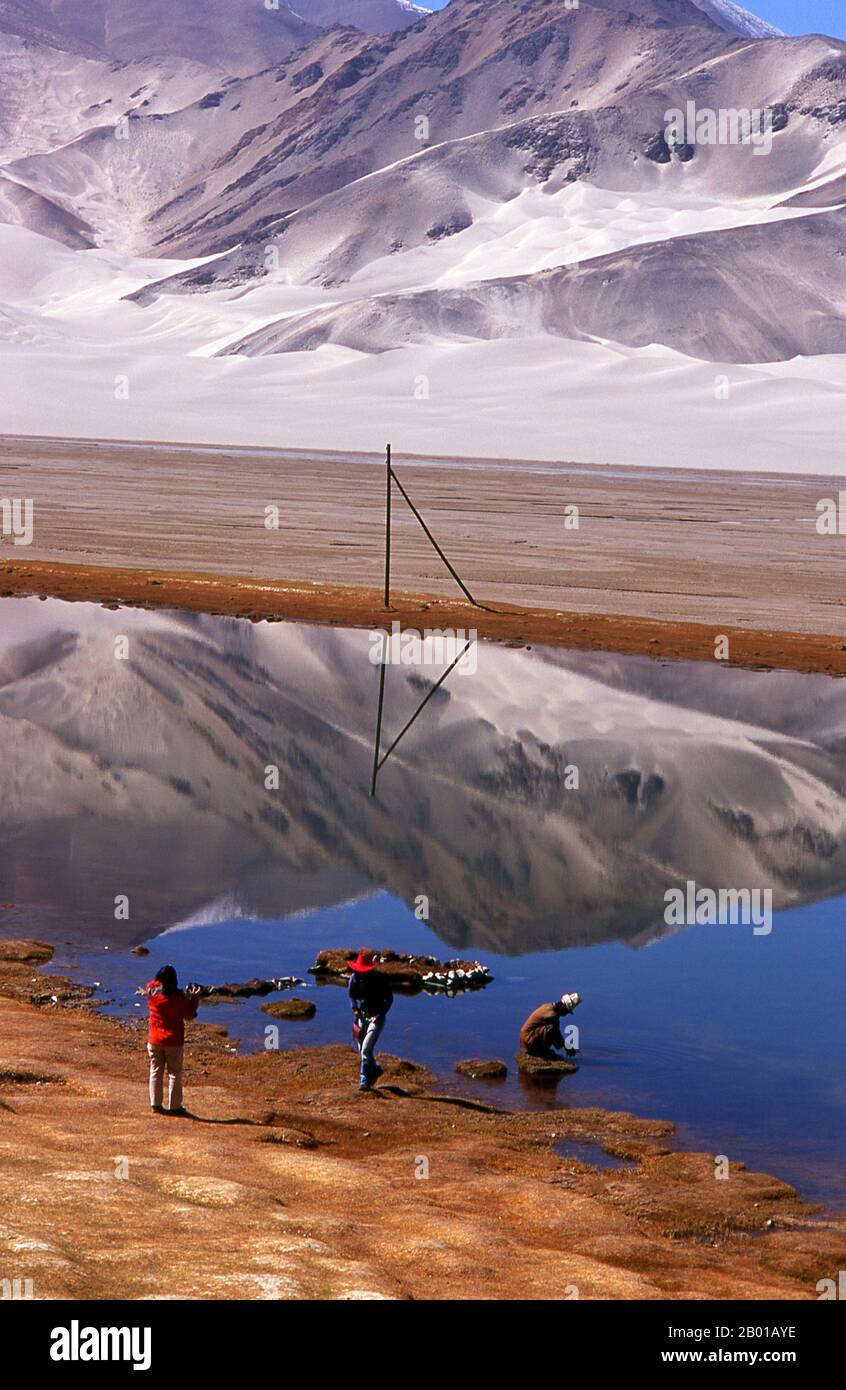 China: Tourists near the Kangxiwa River high up in the Pamir Mountains ...