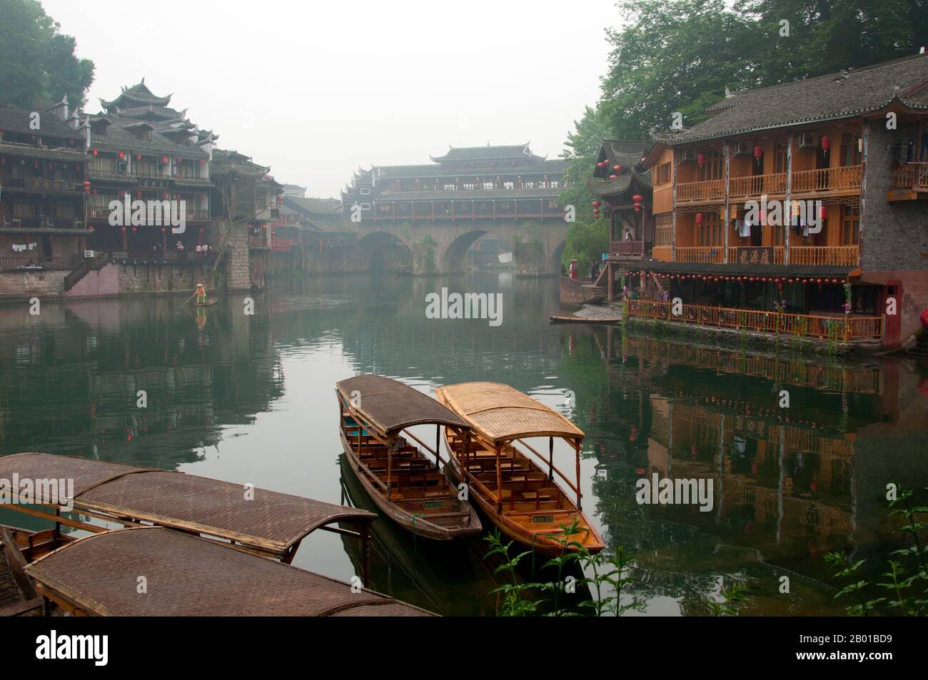 China: Early morning on Fenghuang's misty Tuo River. Fenghuang is ...