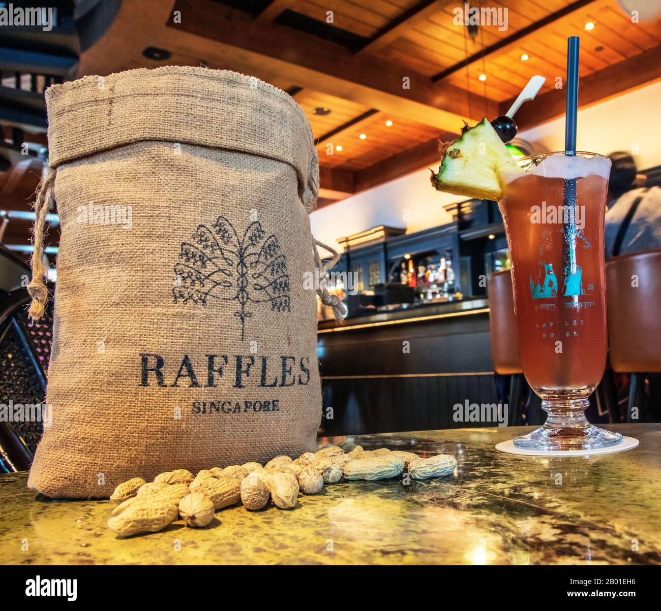 Raffles Bar in Singapore showing a bag of peanuts, peanuts on the table ...