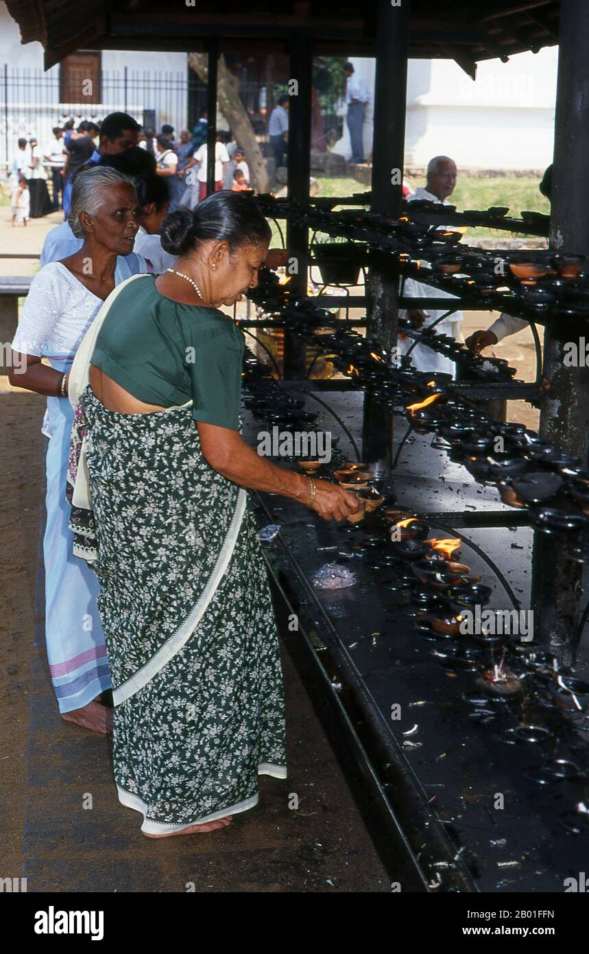 Sri Lanka: Devotees light candles, Sri Dalada Maligawa or the Temple of the Tooth, Kandy. Sri ...