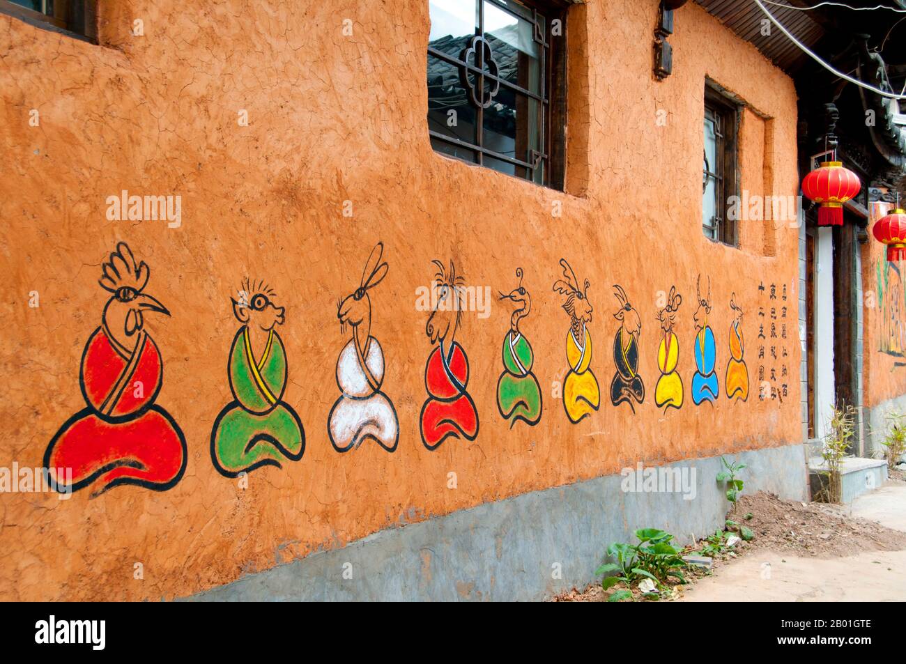 China: Dongba (Naxi) pictographic script adorns a house in the Old Town ...