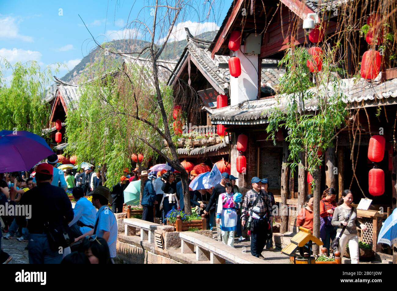 China: A busy street in Lijiang Old Town, Yunnan Province. The Naxi or ...