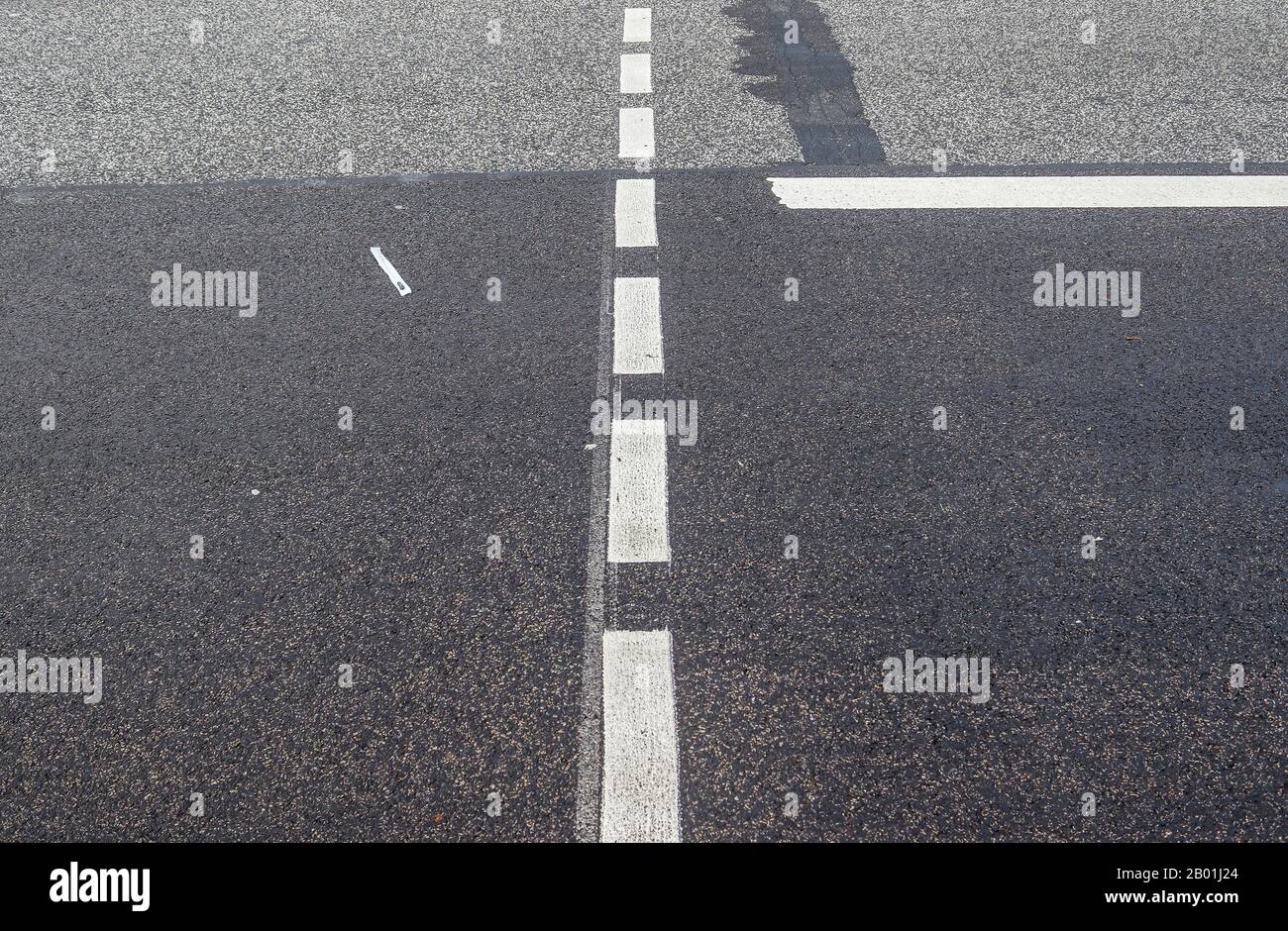 White lines and symbols on the asphalt of european roads Stock Photo ...